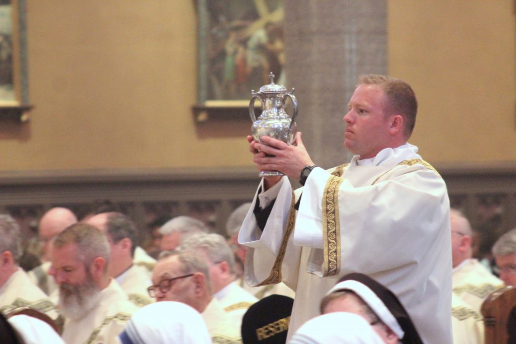 The Catholic Post Priests renew vows, holy oils are blessed during ...