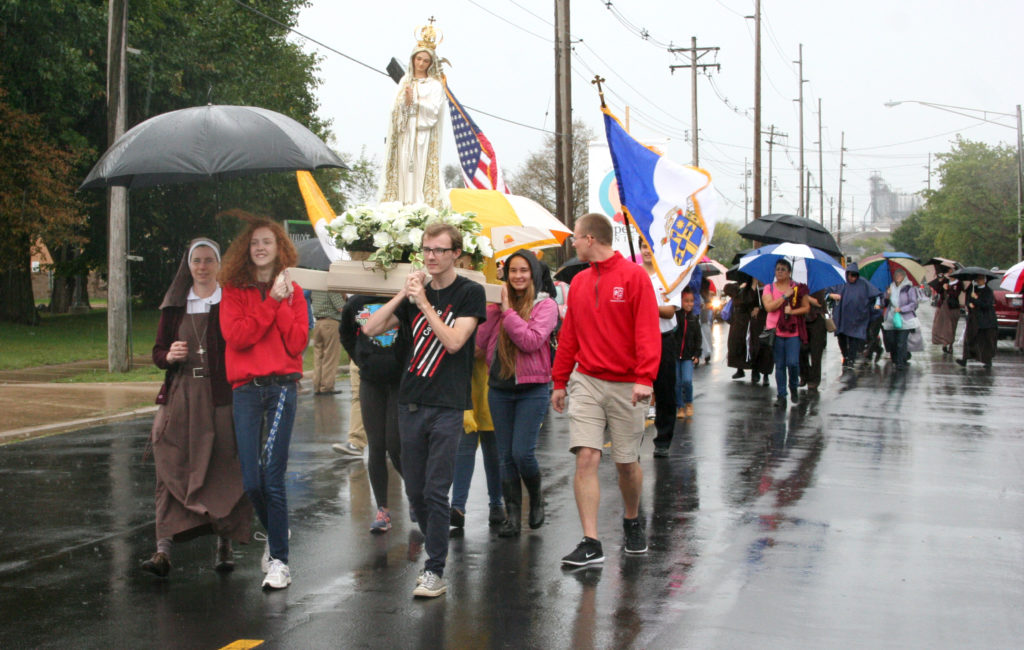 The Catholic Post Hundreds March for Mary in rain at diocese’s ...