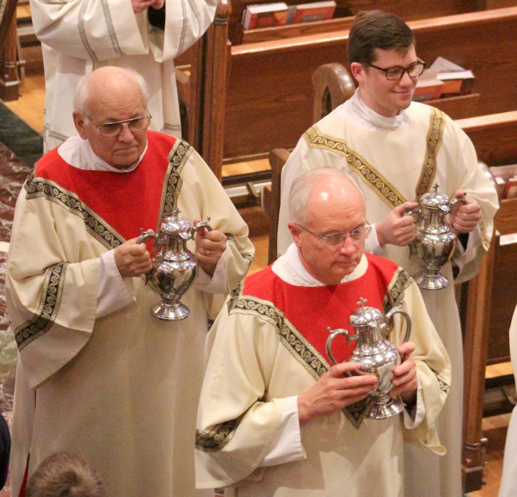 The Catholic Post Priests renew promises as sacramental oils are ...